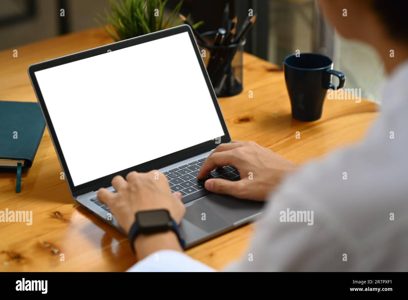 View over shoulder businessman hands typing on laptop keyboard, white ...