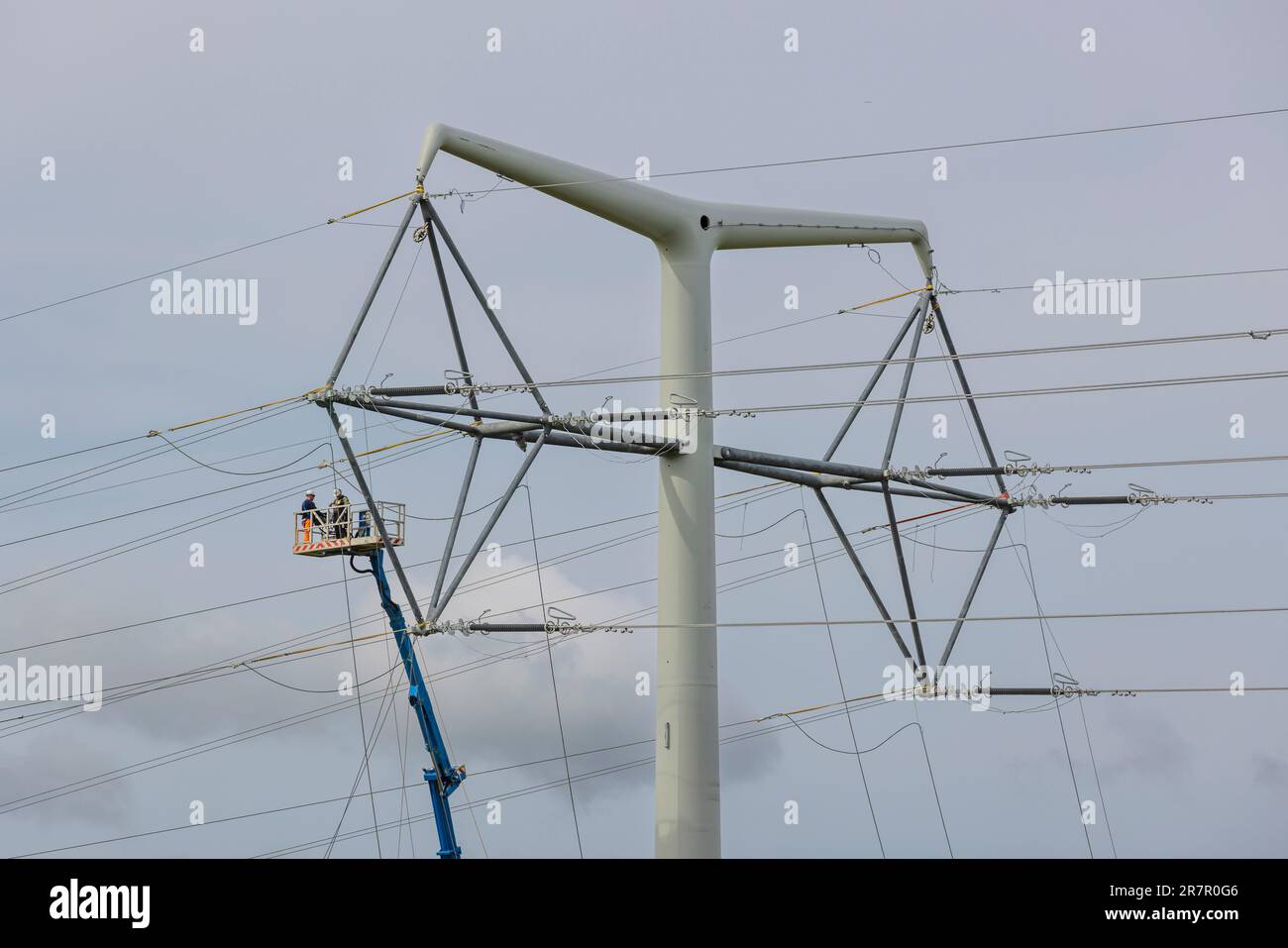 Pulling the power cables through snatch blocks Stock Photo - Alamy