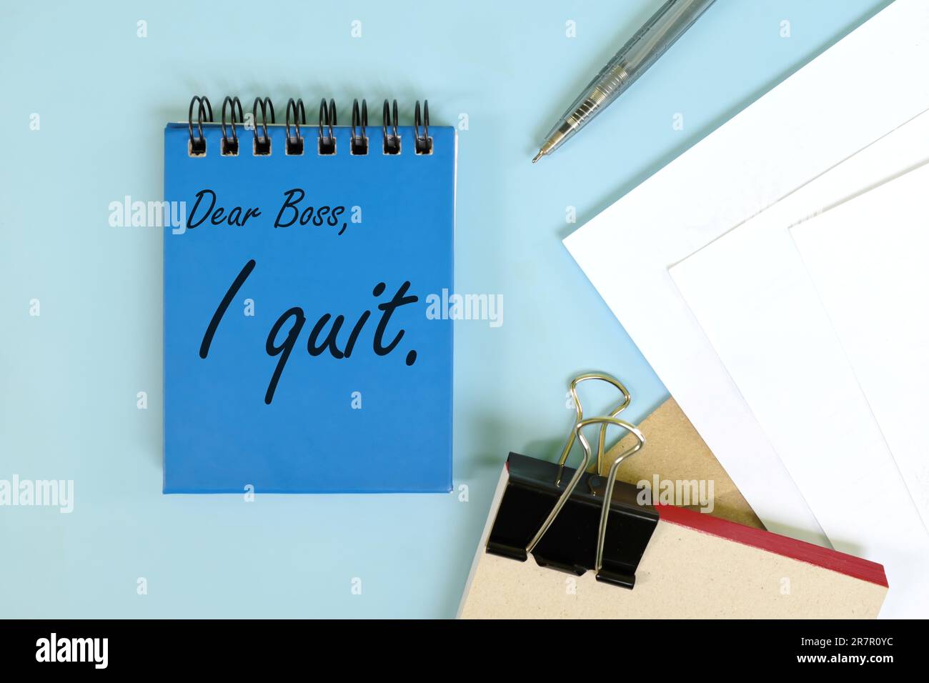 Workplace resignation concept. Office flat lay of blue notepad with I ...