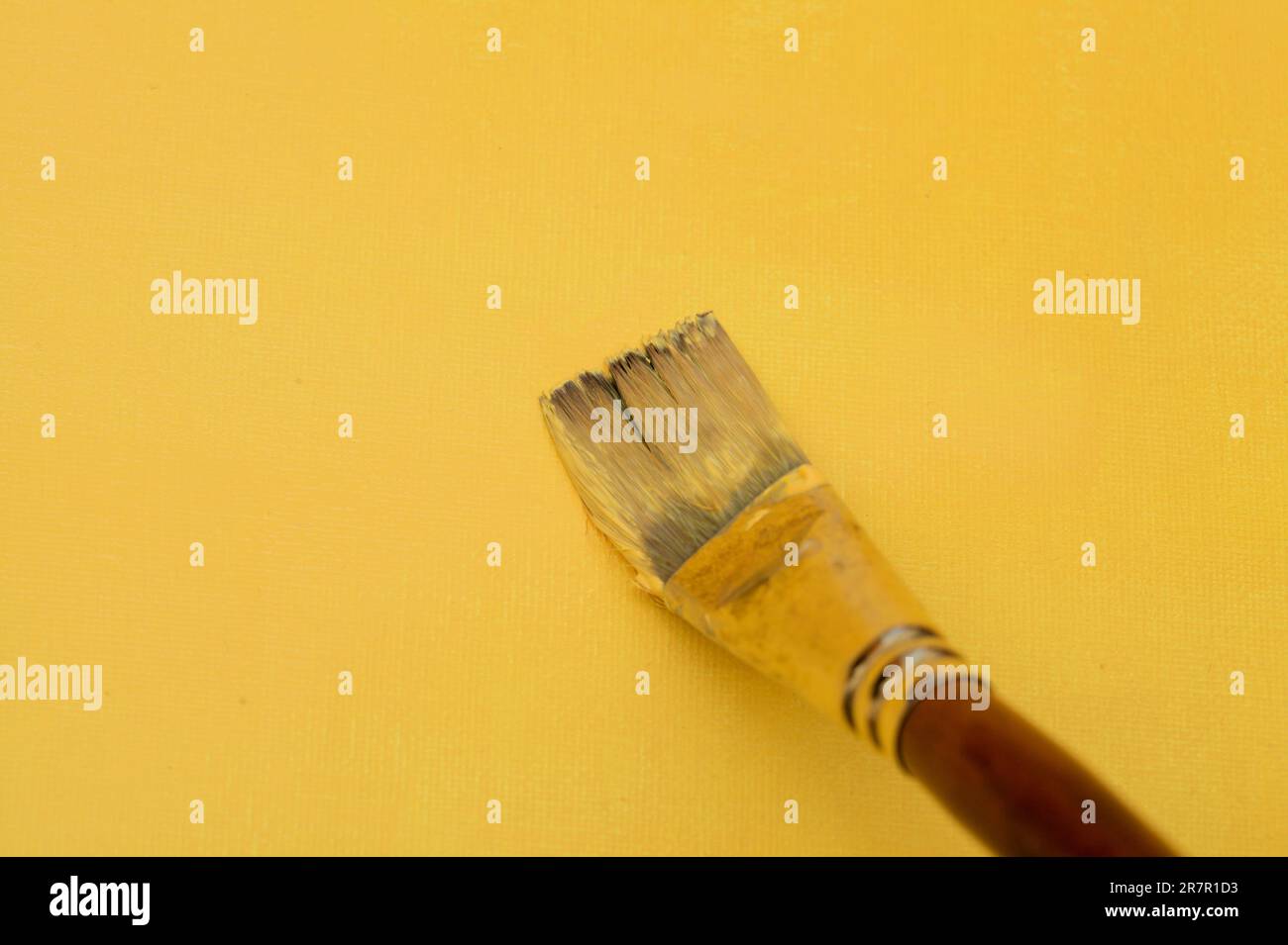 Canvas with a yellow ground color, uneven rough weave Stock Photo - Alamy