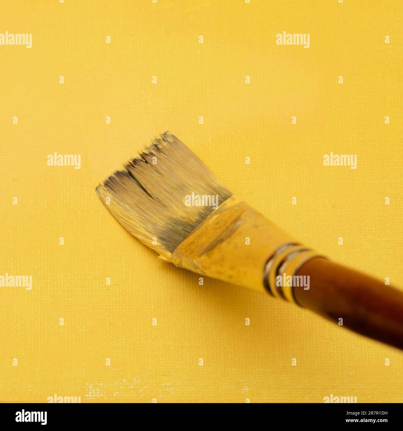Canvas with a yellow ground color, uneven rough weave Stock Photo - Alamy