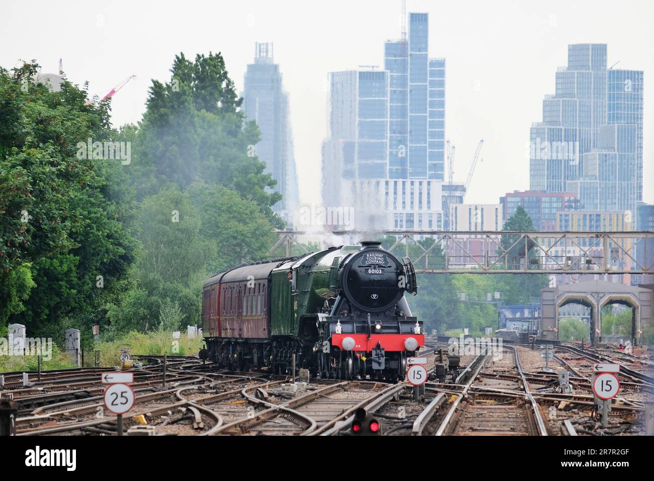 London, UK. 17th June, 2023. The Flying Scotsman locomotive passes through Clapham Junction as ...