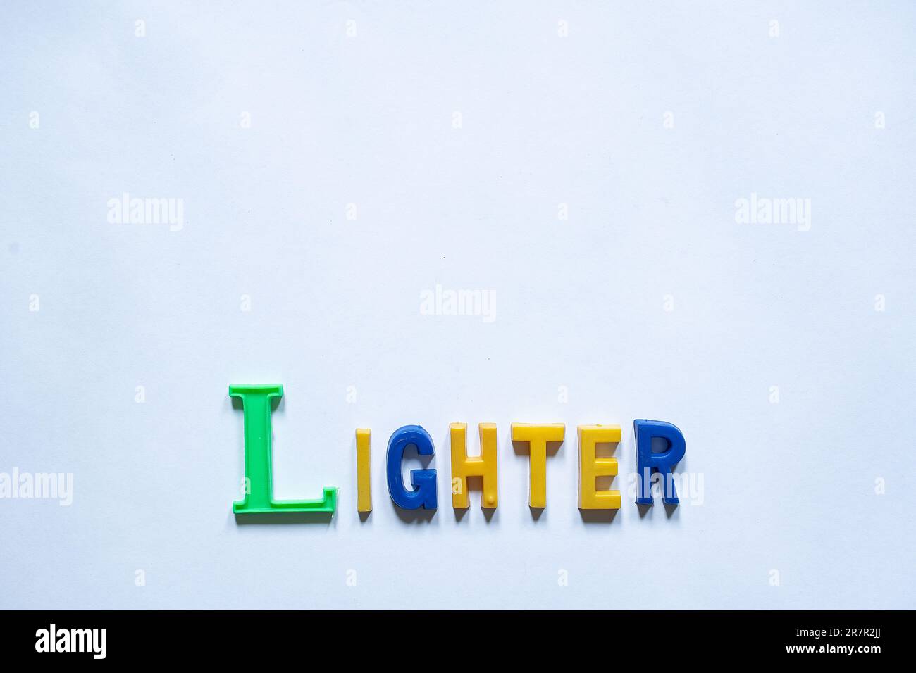 The word "LIGHTER" is created by arranging a set of 3D colorful plastic ...