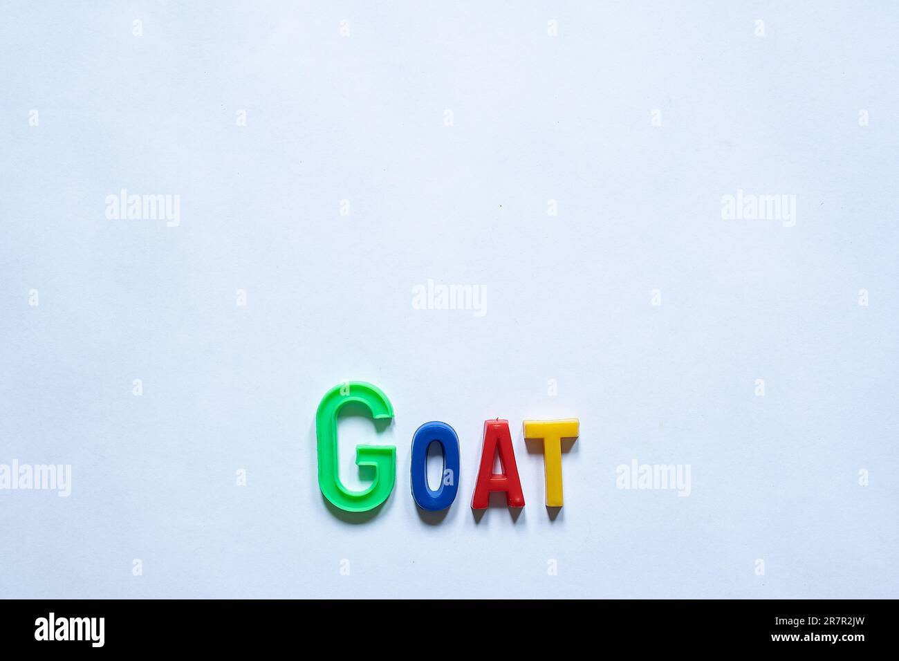 The word "GOAT" is created by arranging a set of 3D colorful plastic ...