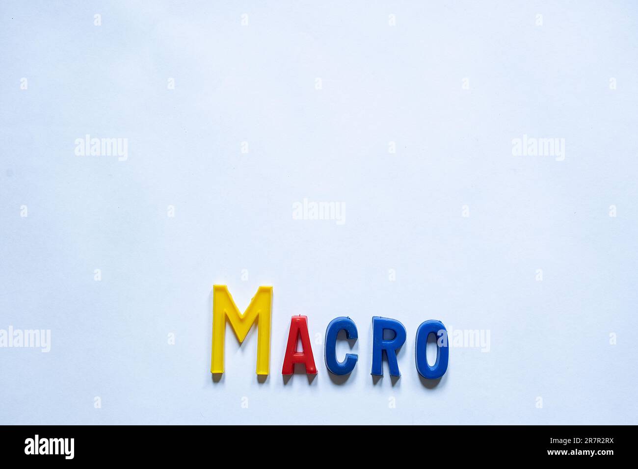 The word "MACRO" is created by arranging a set of 3D colorful plastic ...
