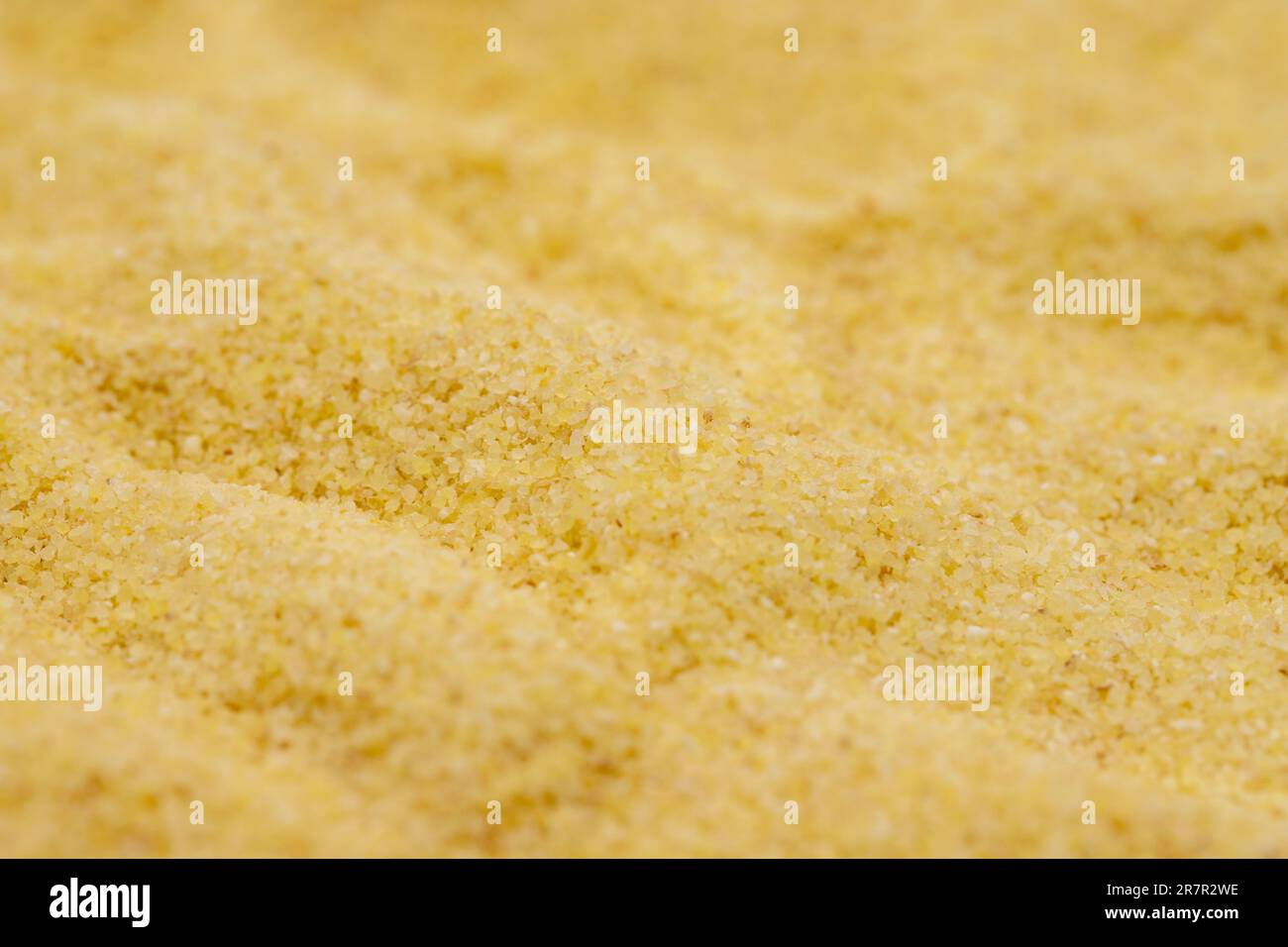 Pile of dry organic semolina flour as background. Close-up Uncooked ...