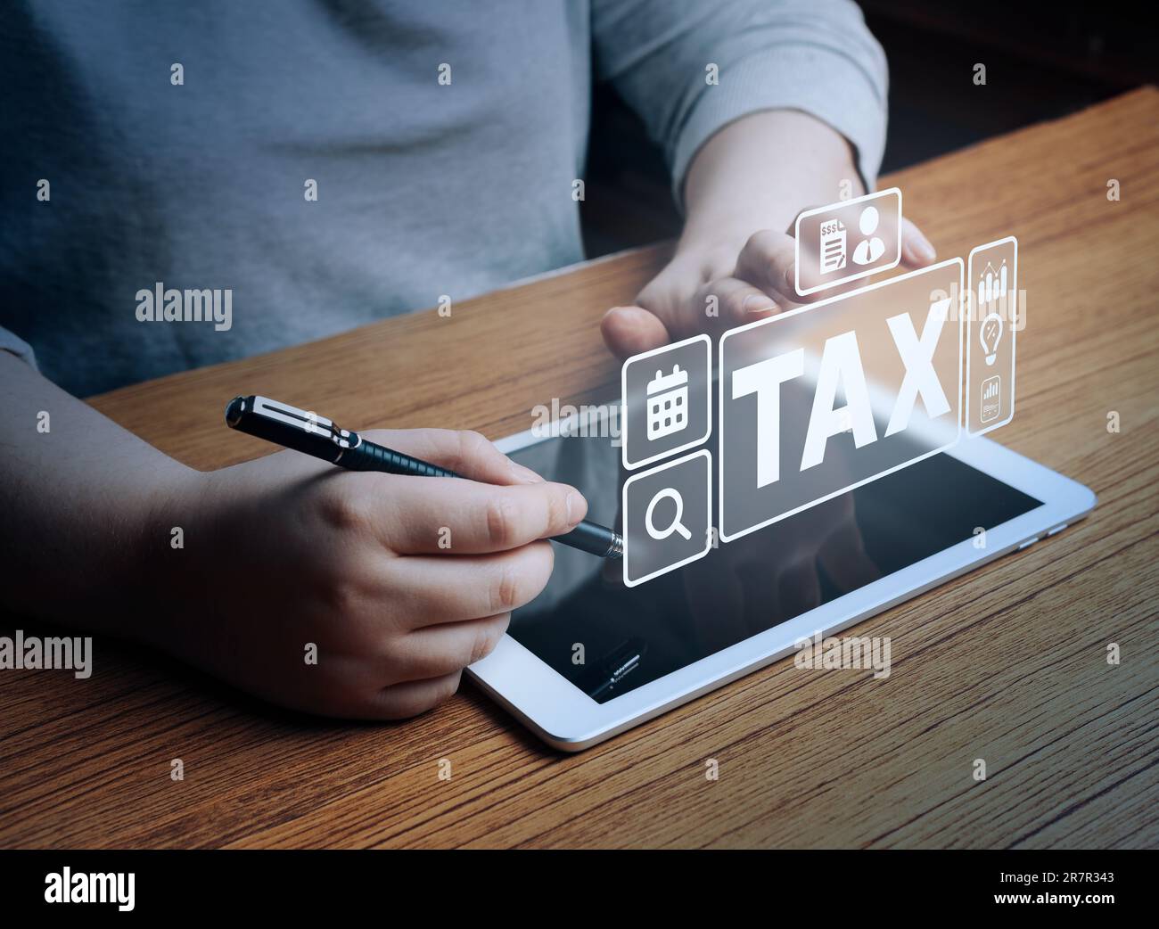 Woman use digital tablet to calculate tax reduction. Tax deduction ...