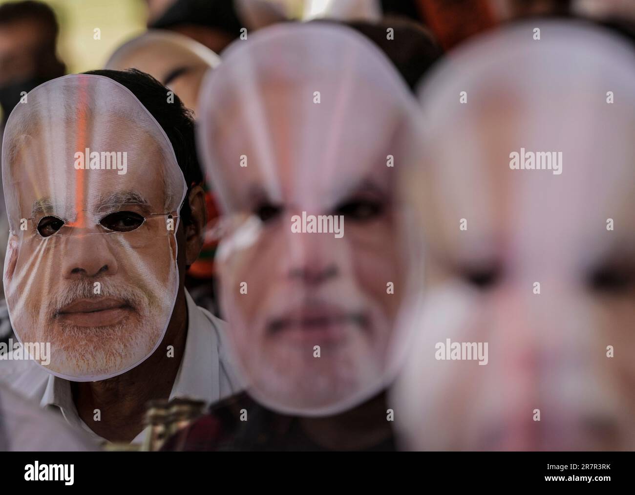 Activists of India's ruling Bharatiya Janata Party (BJP) wear masks of ...