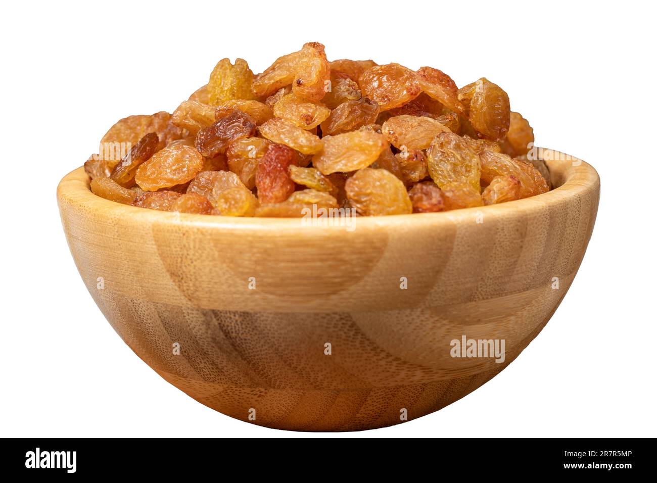 Raisins isolated on white background. Sun-dried grapes in wooden bowl ...