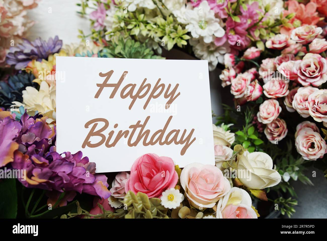 Happy Birthday text message on paper card with beautiful flowers ...