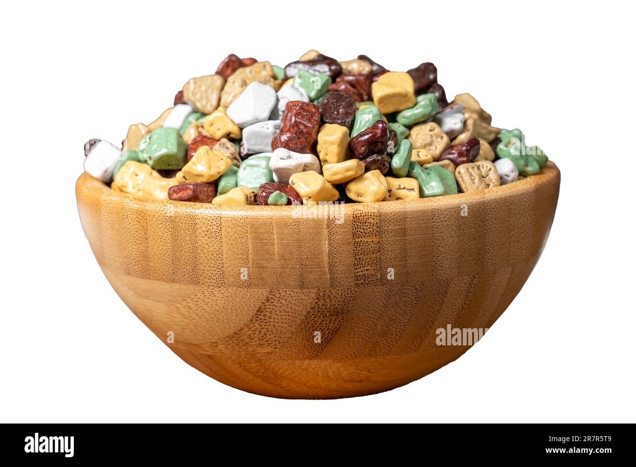 Colorful chocolate candy stones. Stone chocolate dragee in wooden bowl ...