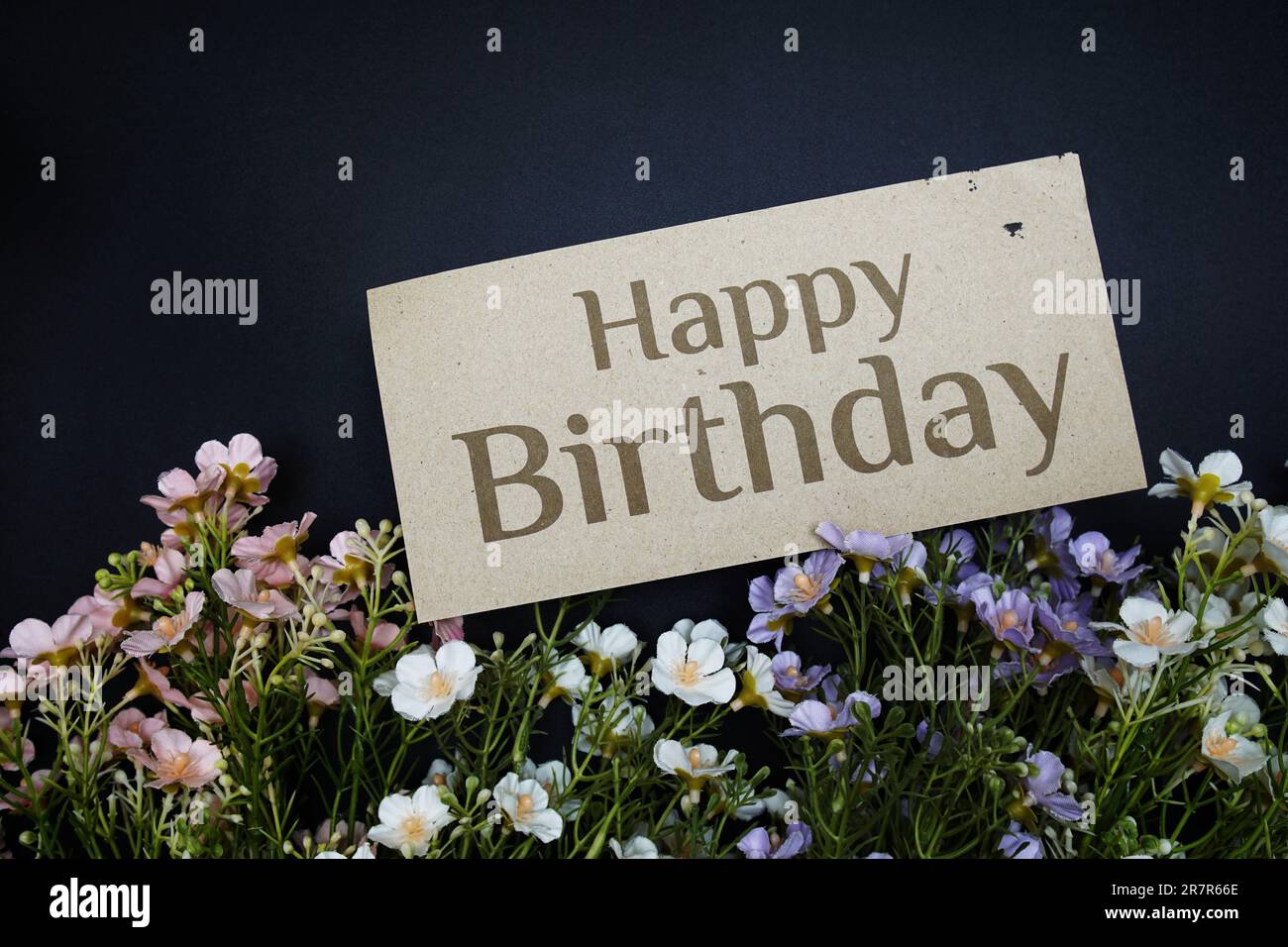 Happy Birthday text message with flower decoration on black background ...