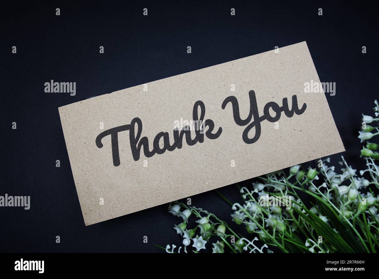 Thank you text message with flower decoration on black background Stock ...