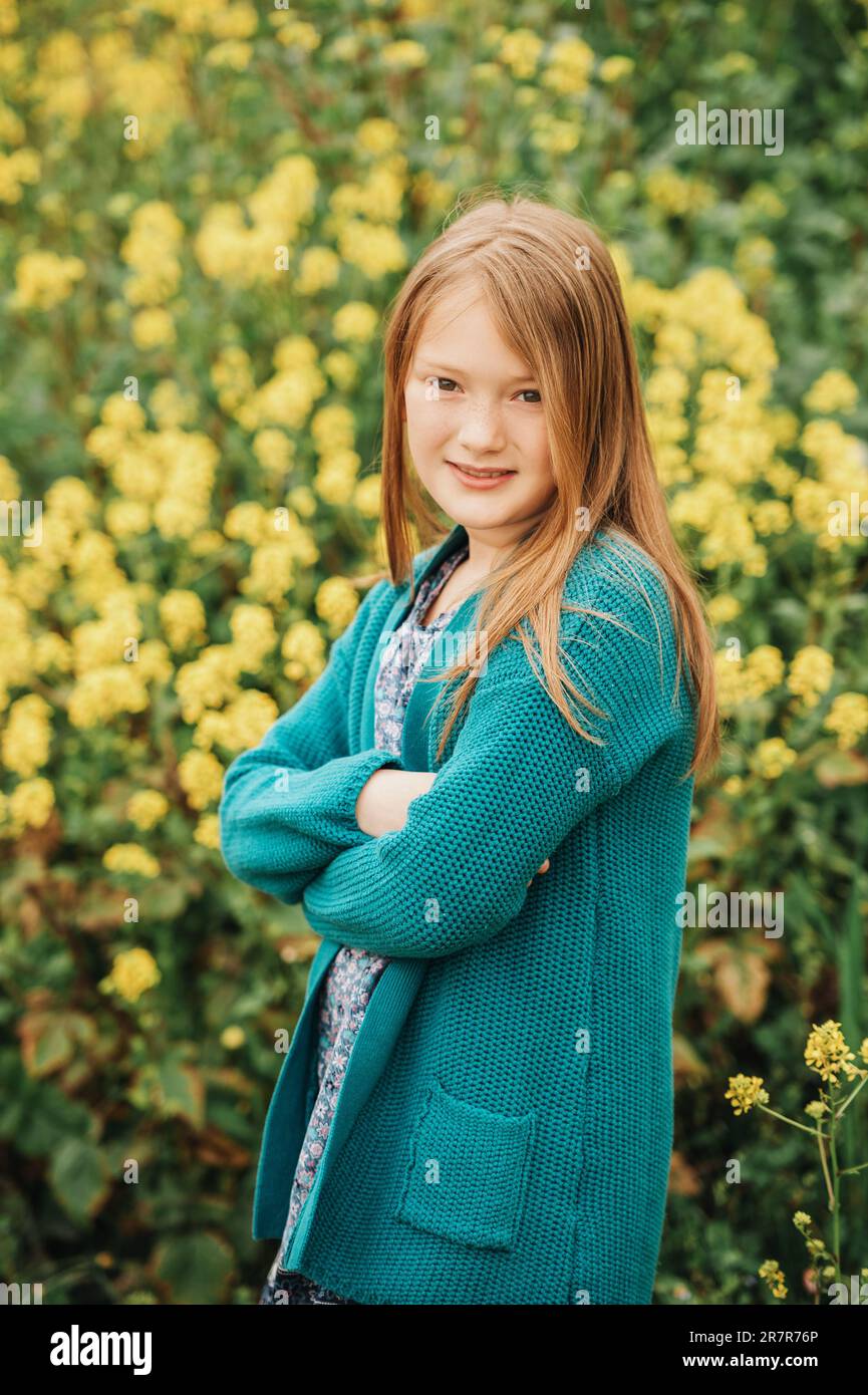 Outdoor Spring Portrait Of Cute 6 7 Year Old Girl Playing In Yellow