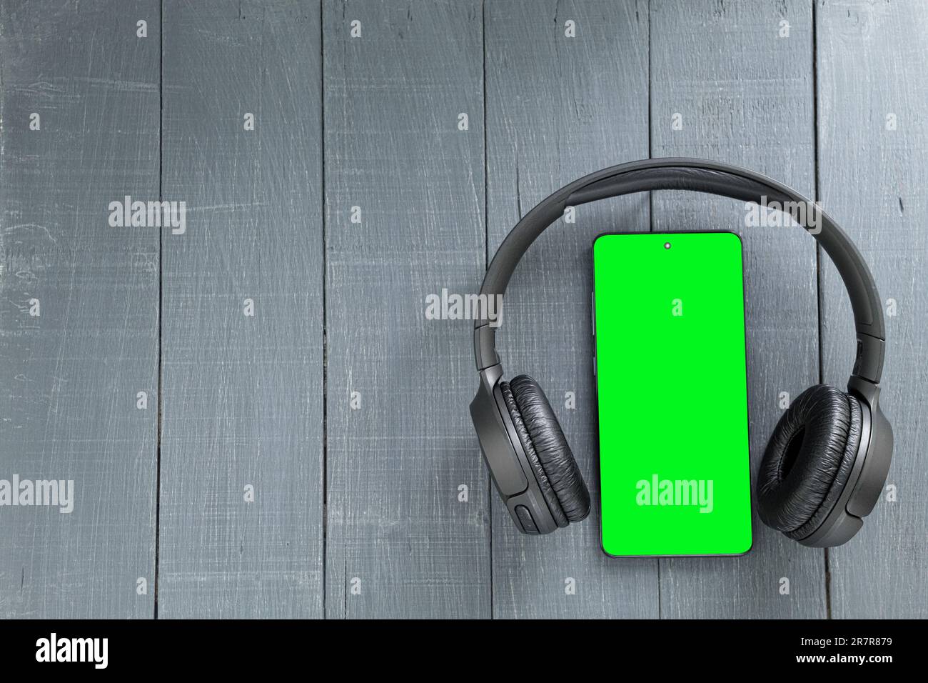 Phone with chroma key screen, wooden background. Copy space. Photo of a ...