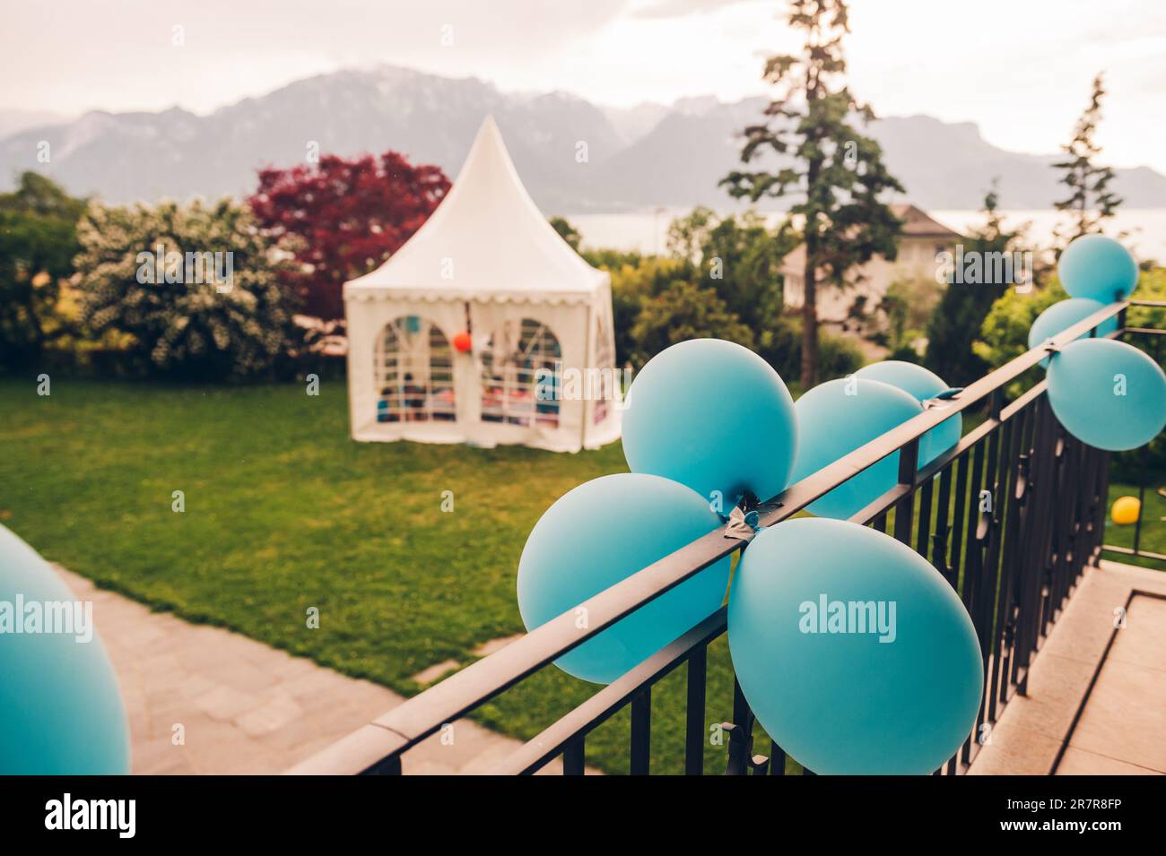 White party tent on backyard, rainy day, birthday party for children ...