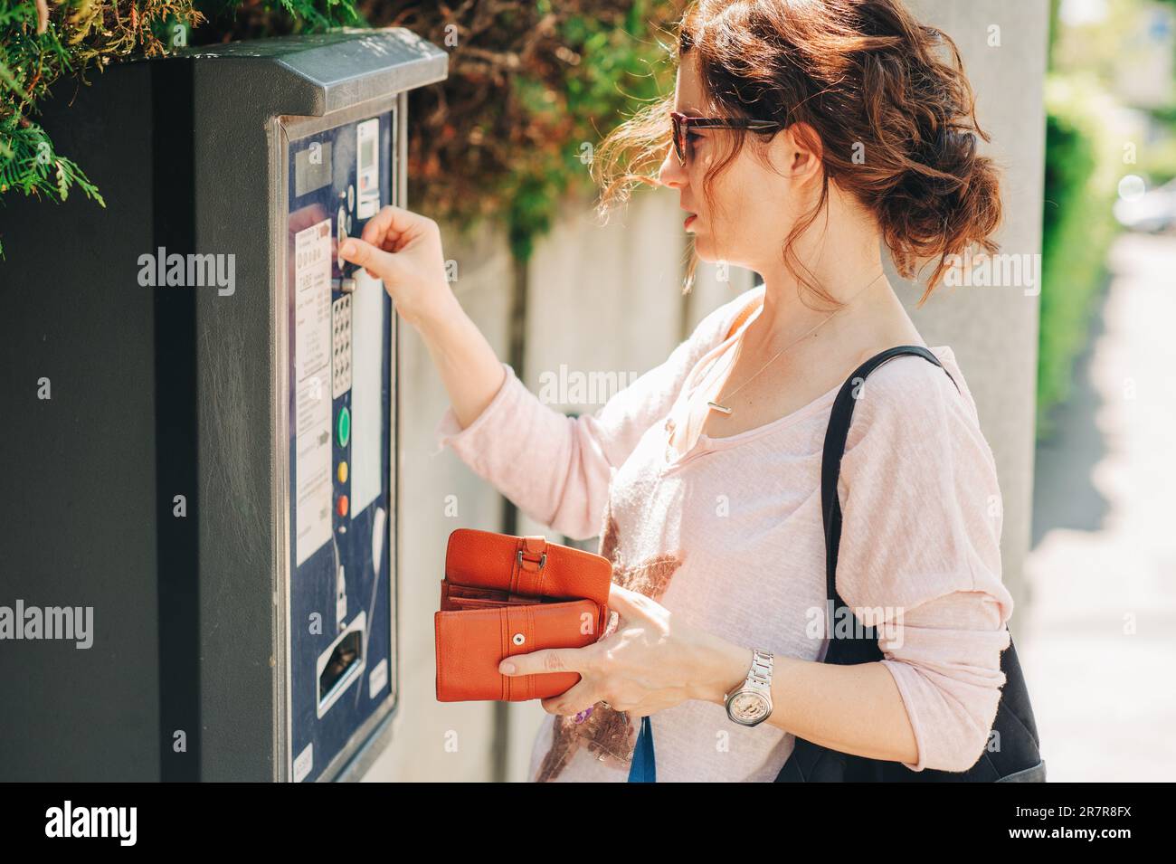 Young woman paying ticket hi-res stock photography and images - Alamy