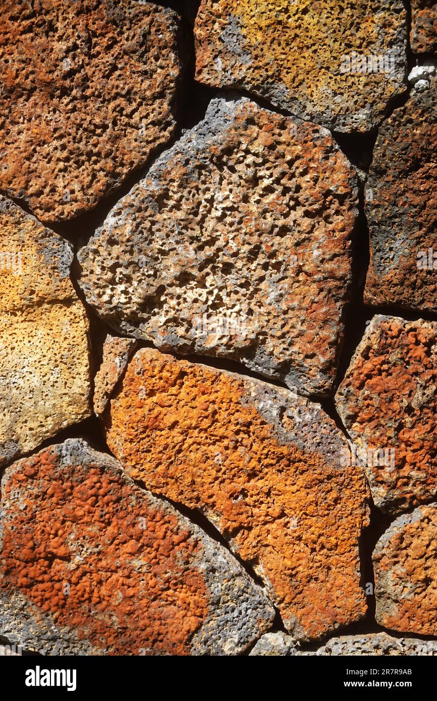 Wall built from lava stones Stock Photo - Alamy