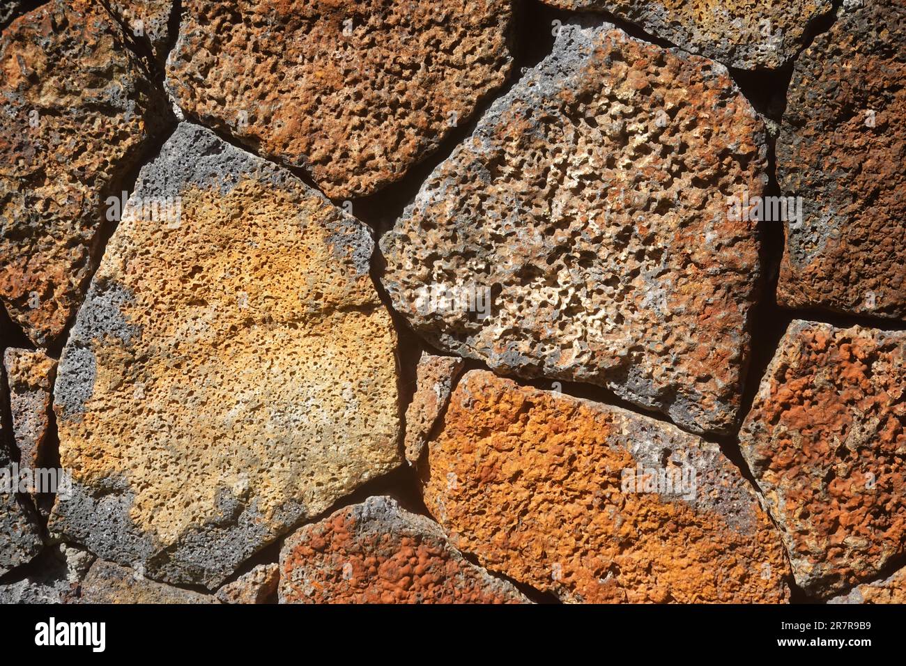 Wall built from lava stones Stock Photo - Alamy