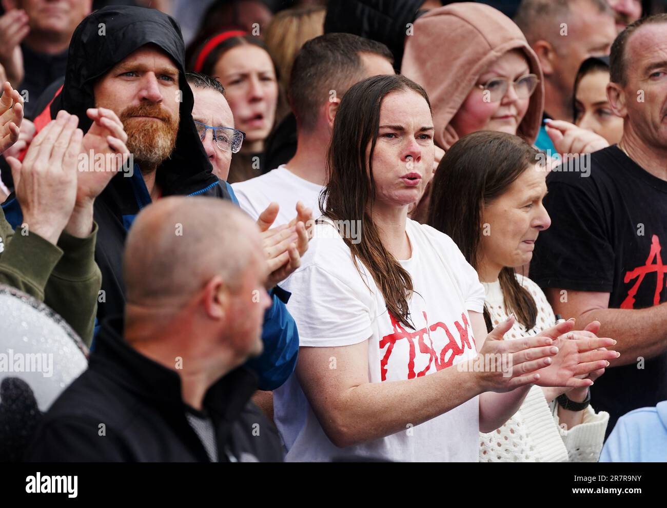 People line the streets of Finglas, Dublin, for a farewell gathering ...
