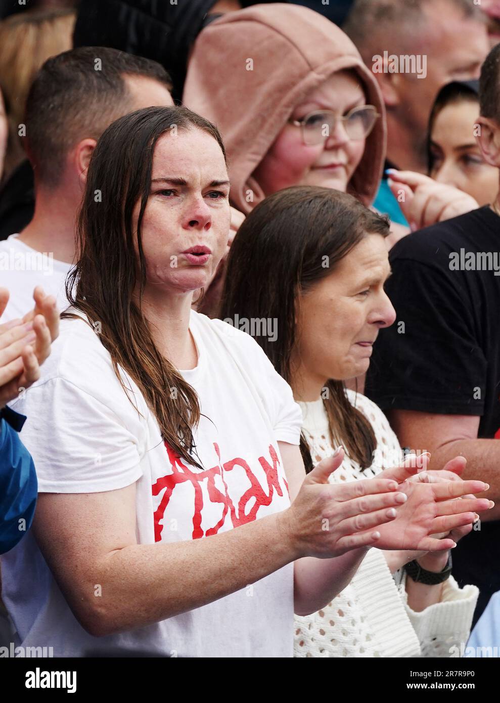 People line the streets of Finglas, Dublin, for a farewell gathering ...