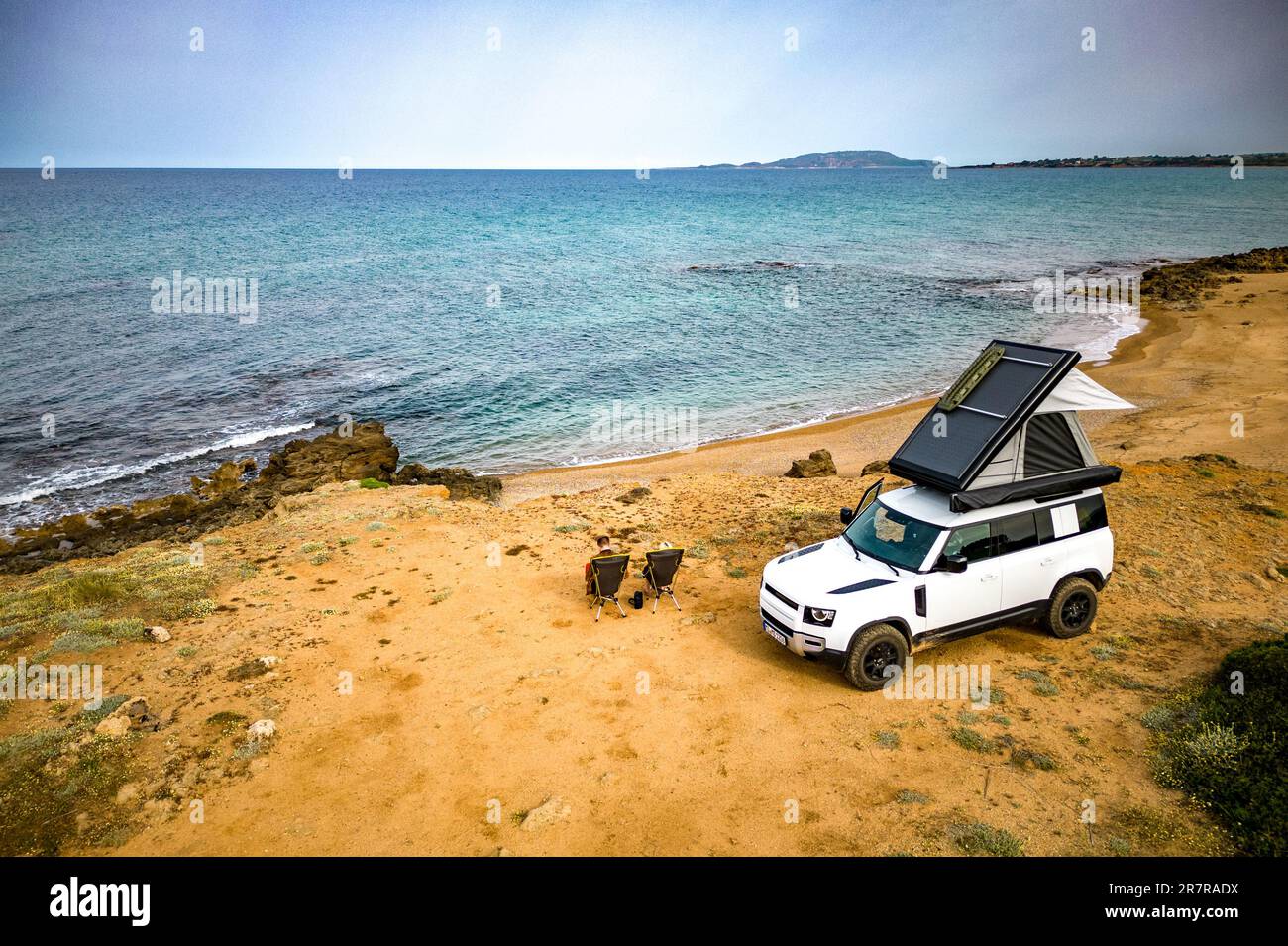 Outdoor Camping Adventure with roof tent on all terrain vehicle on the ...