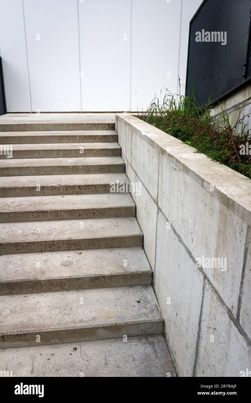 Close up and details of railing and concrete stairs of a modern ...
