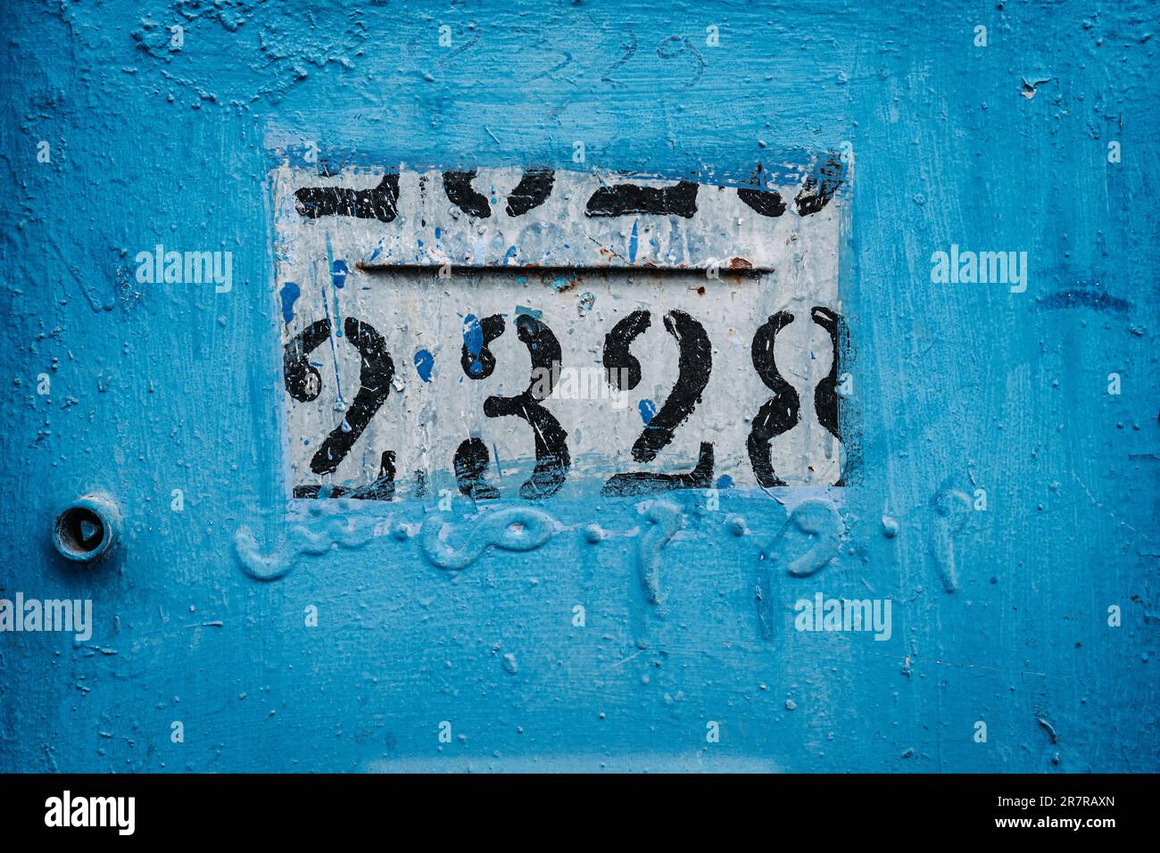 Vibrant blue house post: Numbers adorn this eye-catching house post ...