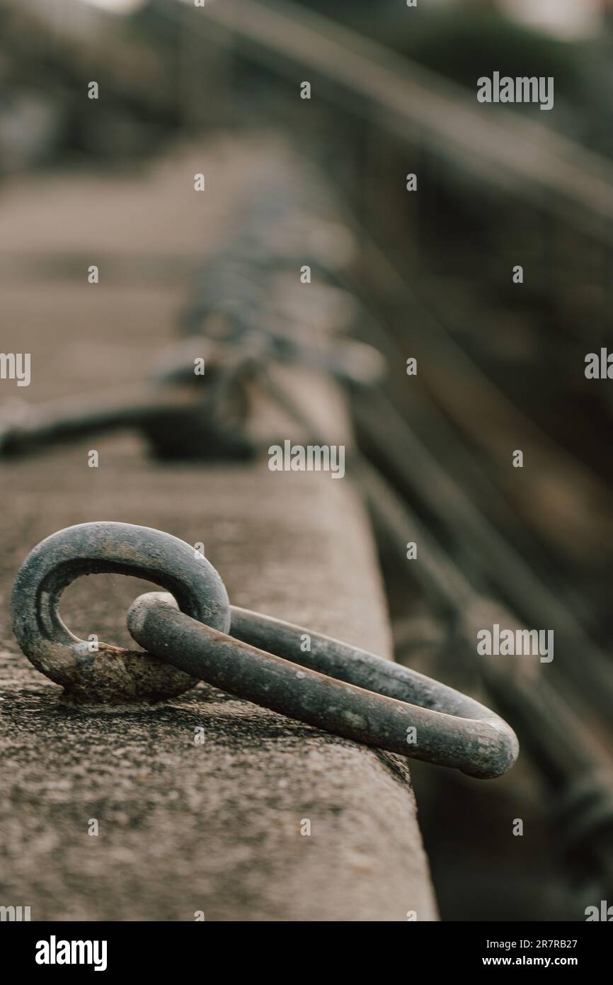 A strong metal ring embedded in stone stands ready to secure boats ...