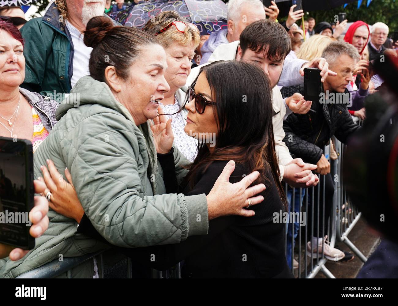 Aslan frontman Christy Dignam's daughter Kiera (centre) is consoled by ...