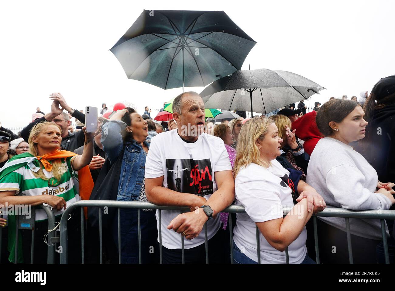 People line the streets of Finglas, Dublin, for a farewell gathering ...