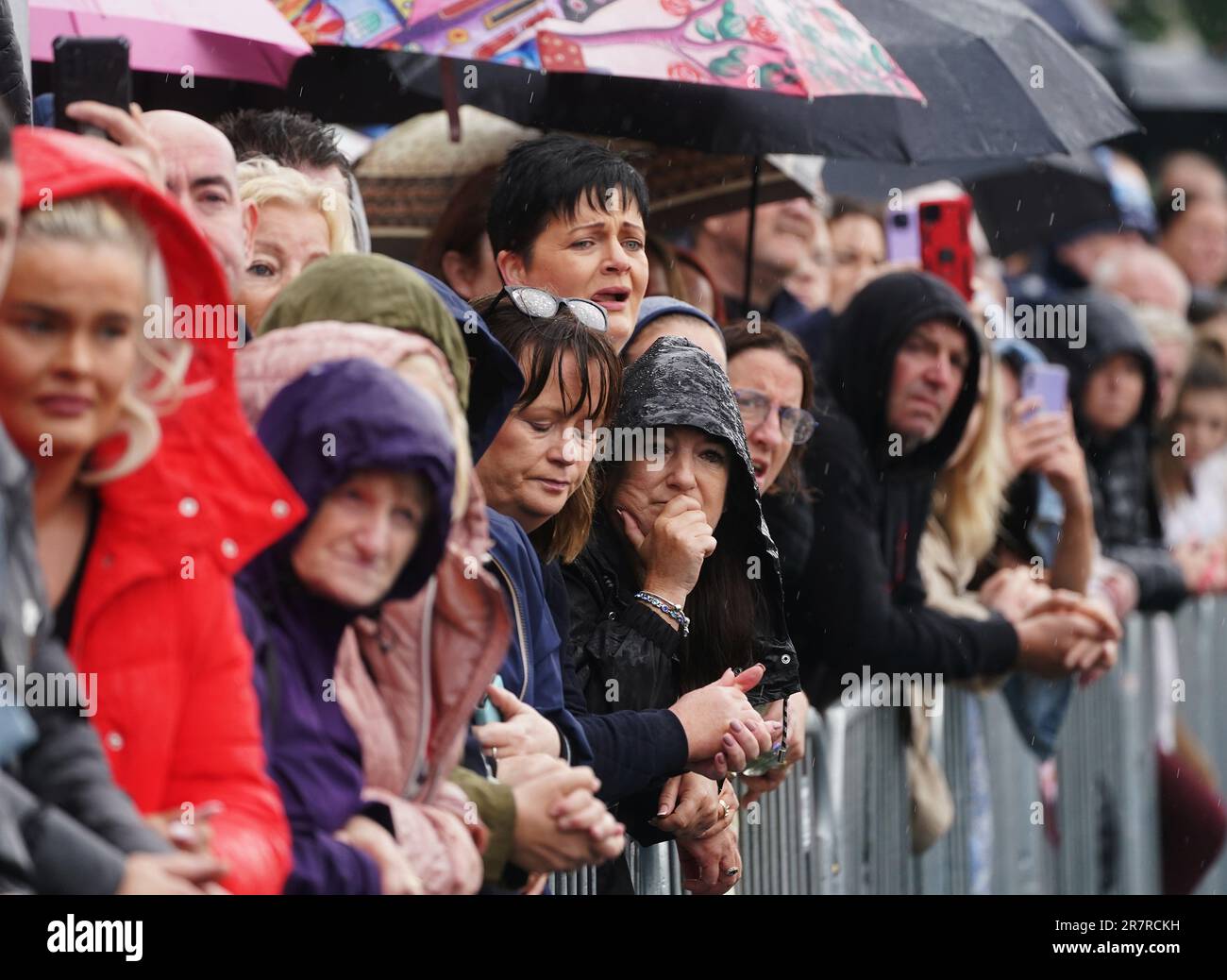 People line the streets of Finglas, Dublin, for a farewell gathering ...