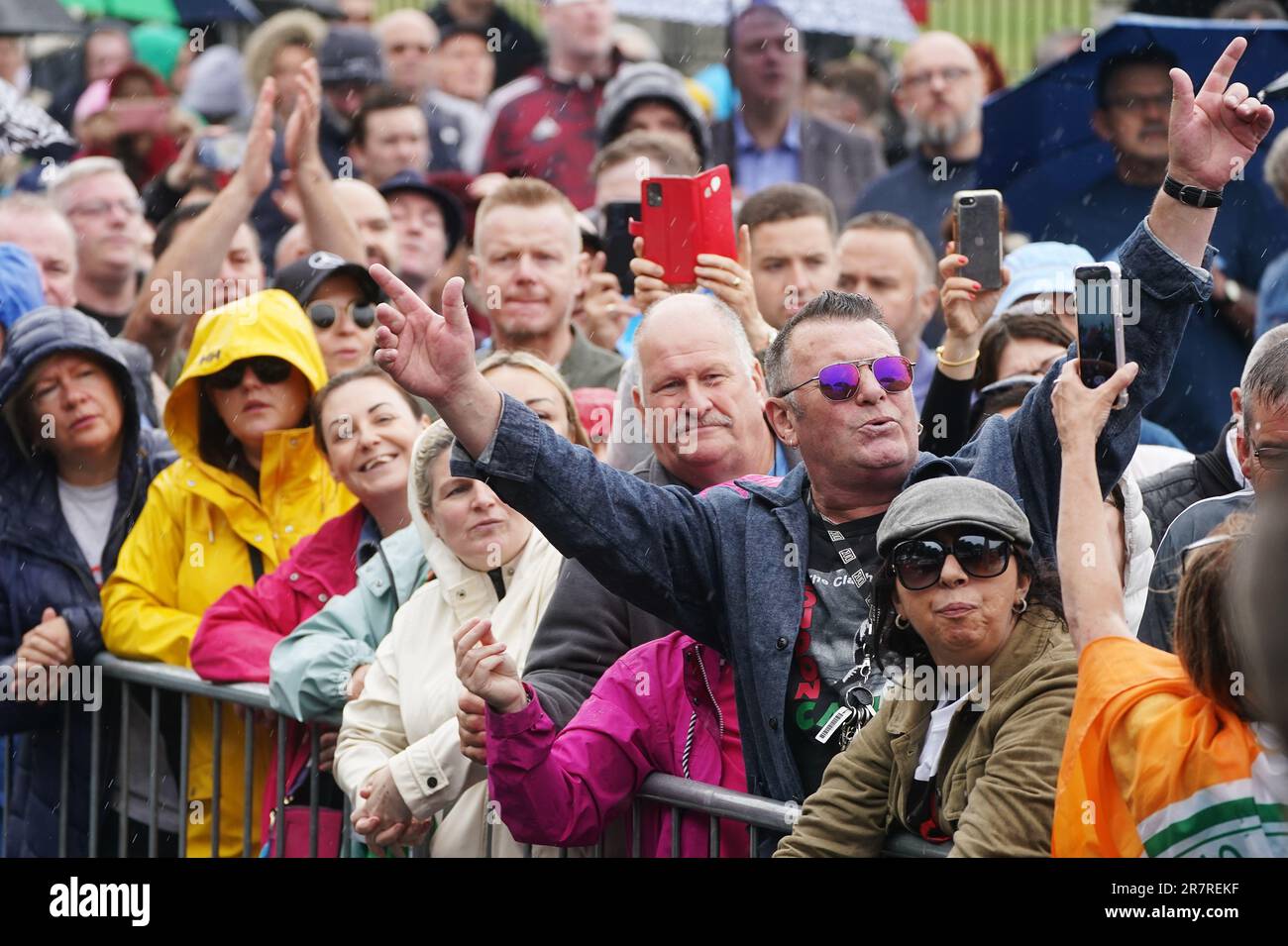 People line the streets of Finglas, Dublin, for a farewell gathering ...
