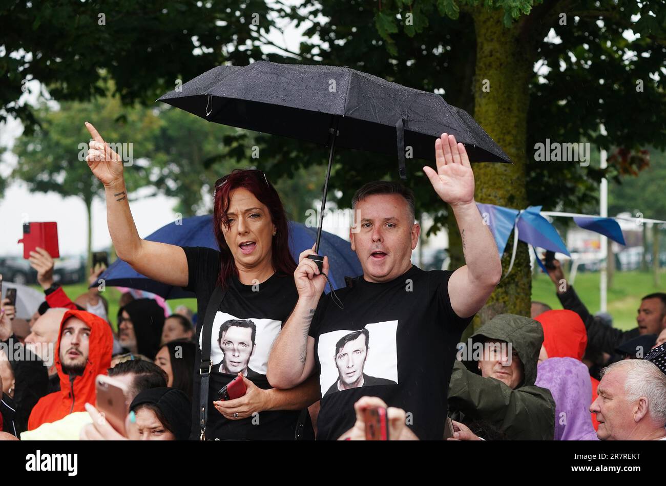 People line the streets of Finglas, Dublin, for a farewell gathering ...