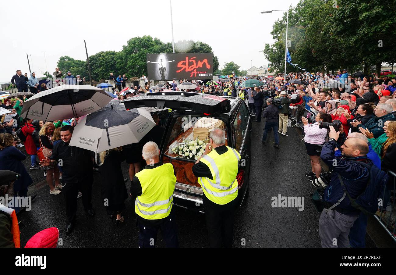 The hearse carrying the coffin of Aslan frontman Christy Dignam stops ...