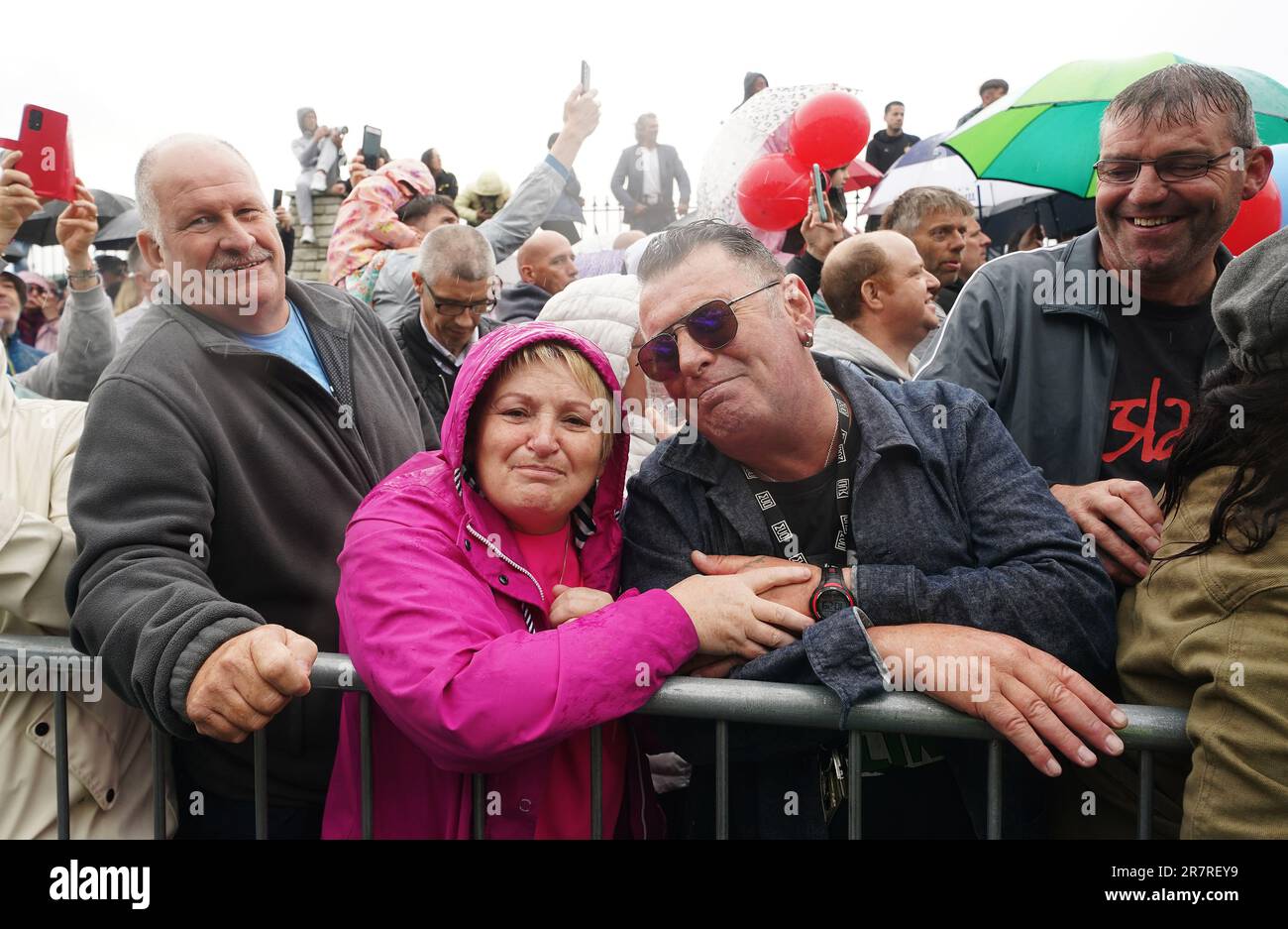 People line the streets of Finglas, Dublin, for a farewell gathering ...