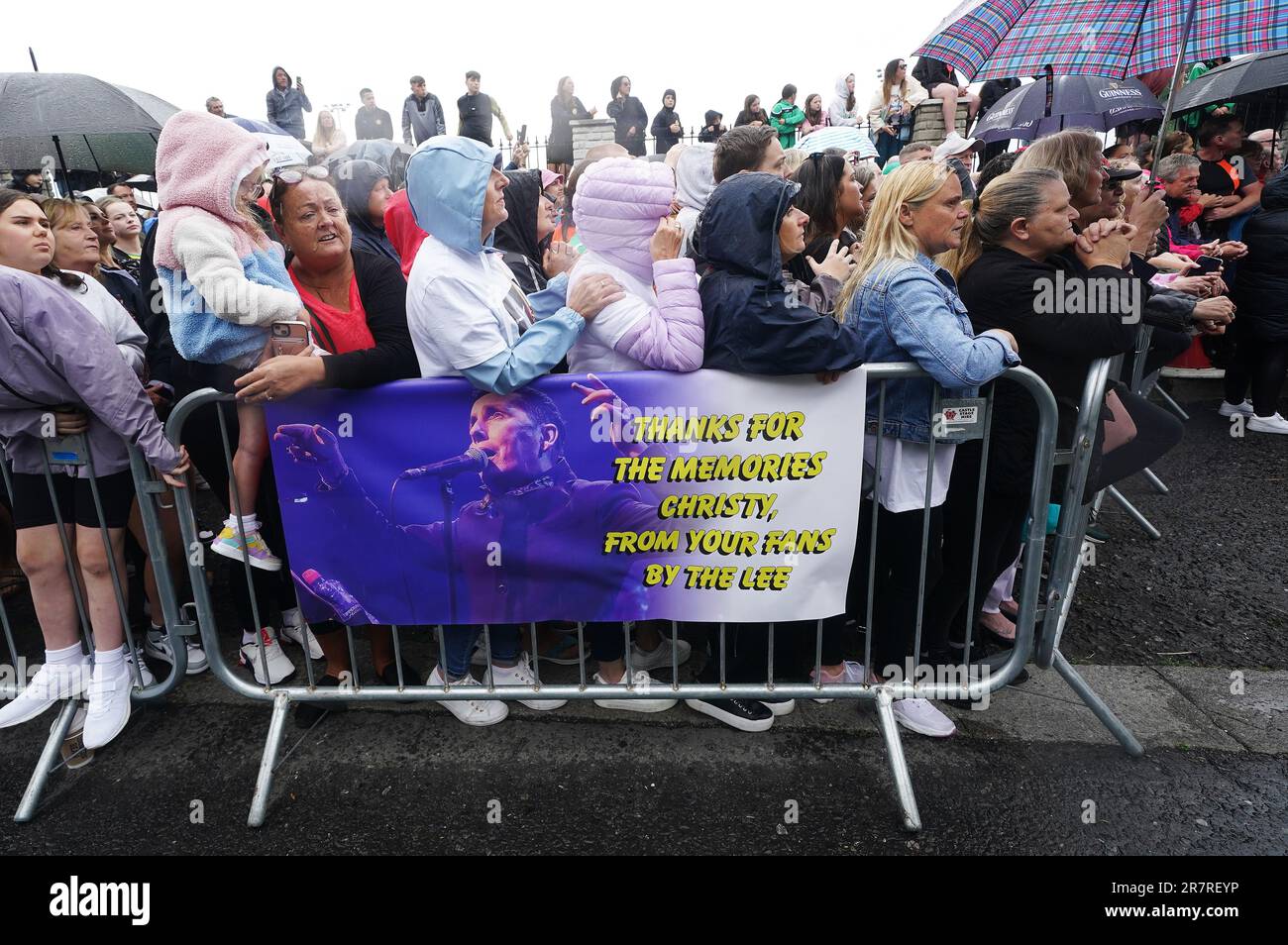 People line the streets of Finglas, Dublin, for a farewell gathering ...