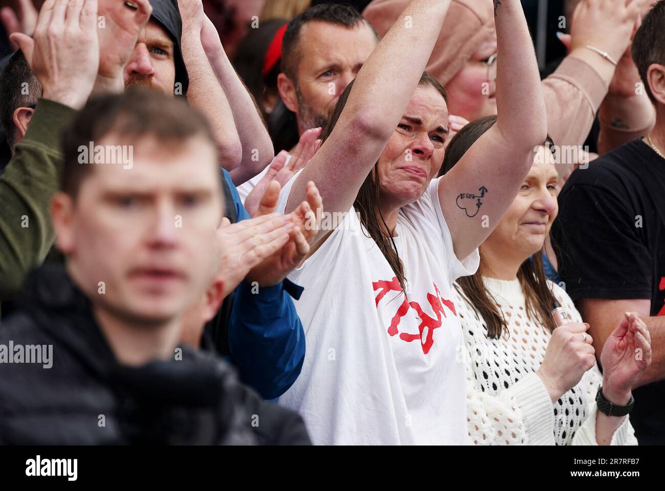 People line the streets of Finglas, Dublin, for a farewell gathering ...