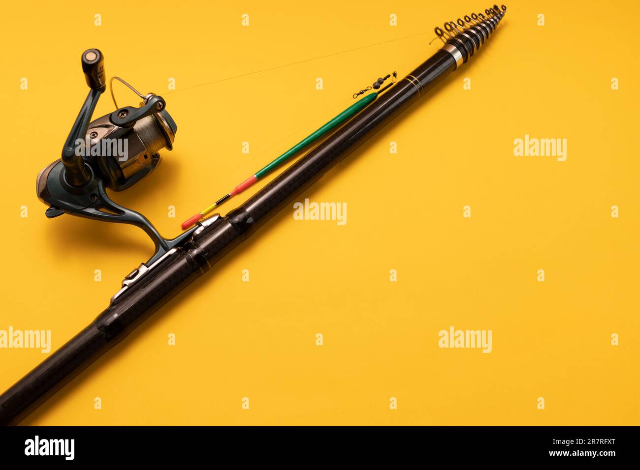 Mockup Fishing Spinning Rod, Reel on Yellow Background. Hobby, Leisure ...