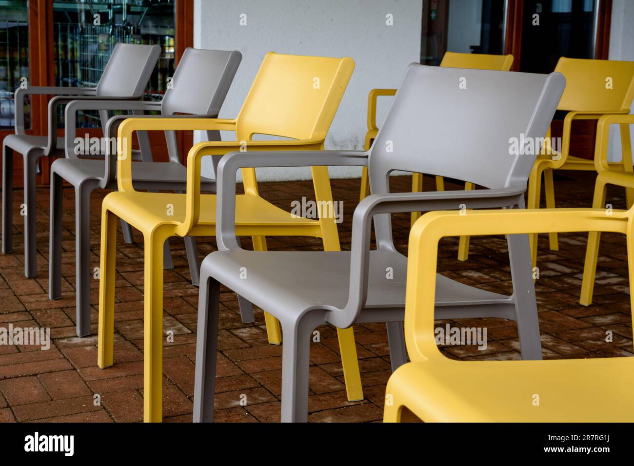 Stack of yellow chairs hi-res stock photography and images - Alamy