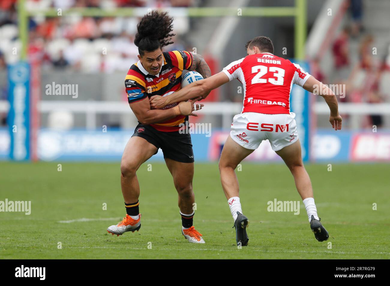 Salford Red Devils’ Tim Lafai (left) gets away from Hull KR’s Louis ...
