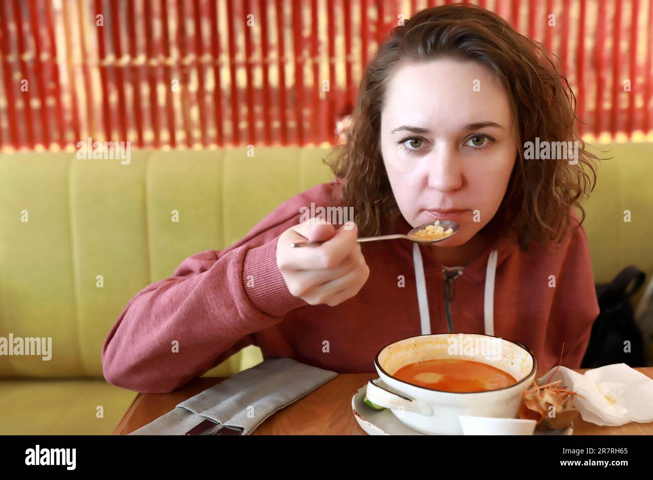 Woman eating in thai cafe hi-res stock photography and images - Alamy