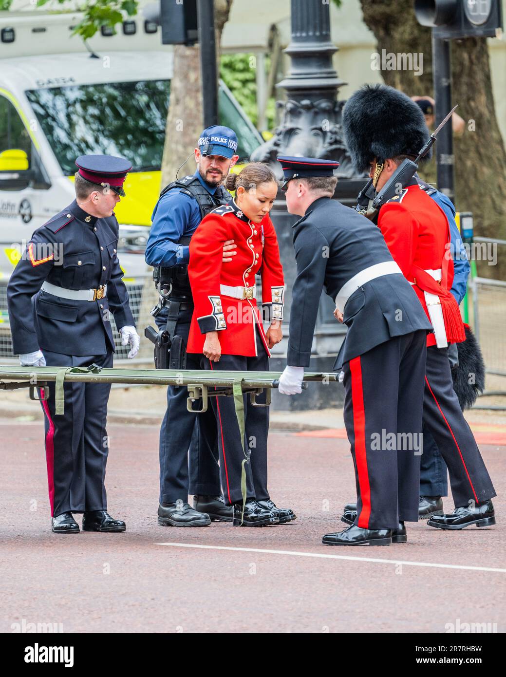 London, UK. 17th June, 2023. A female Guardsman collapses in the ehat ...
