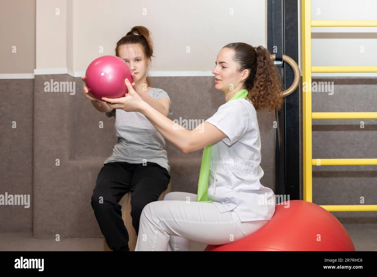 Smiling Girl, Child With Disability Does Physical Exercises With Ball ...