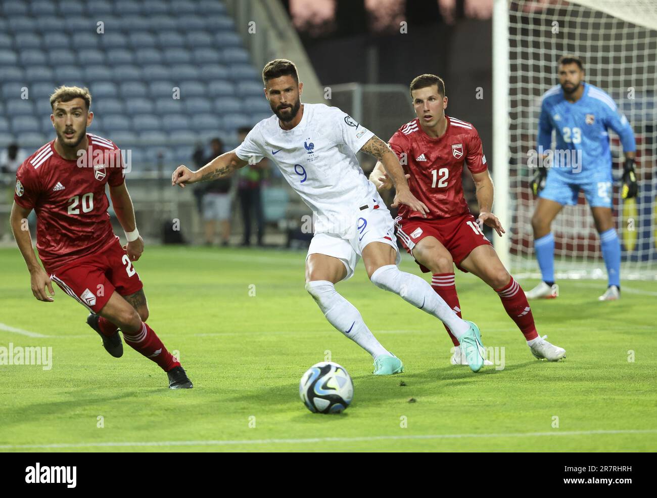 Olivier Giroud of France between Ethan Britto and Jayce Olivero of ...