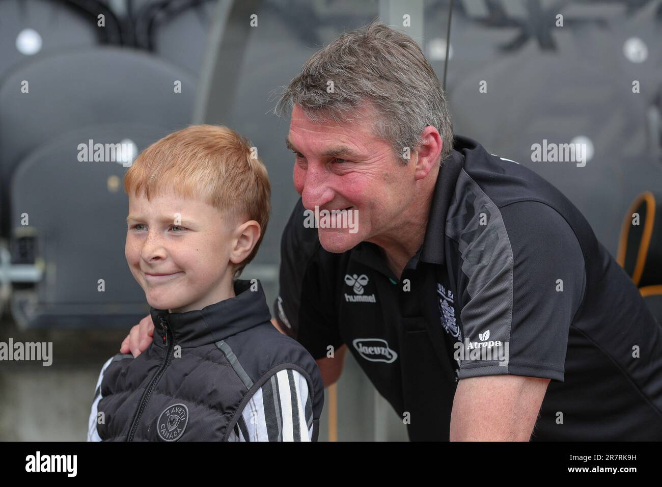 Tony Smith Head Coach of Hull FC has his photo taken with a young fan ...