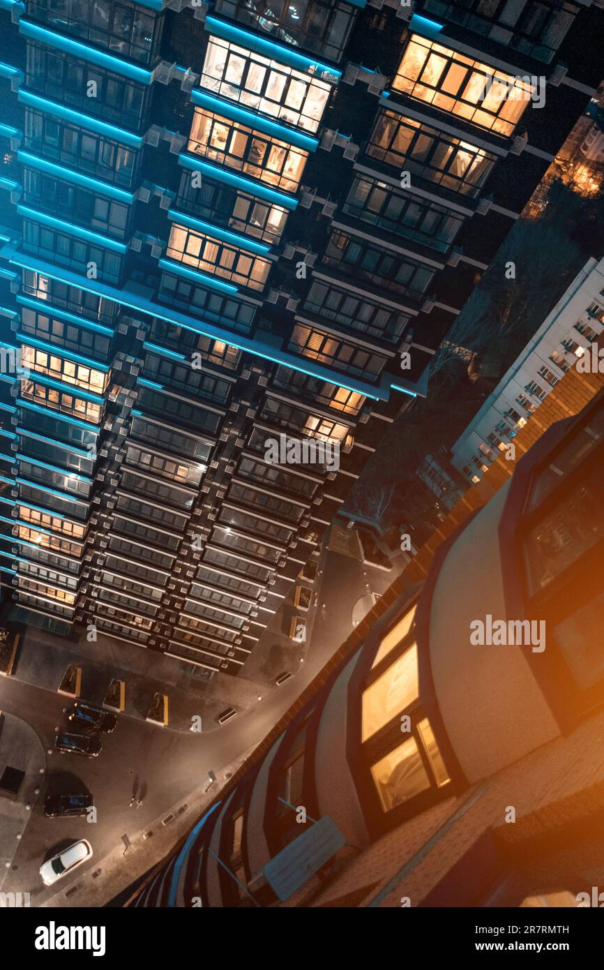 neon light skyscraper residential or office building, view from above ...