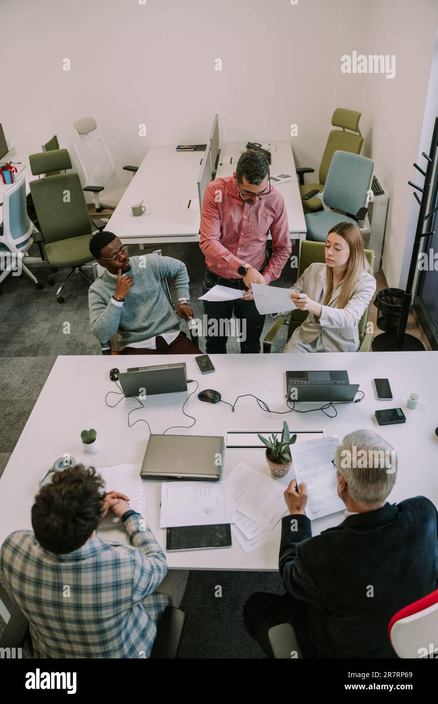 The boss telling his employees about their new job for the client at ...