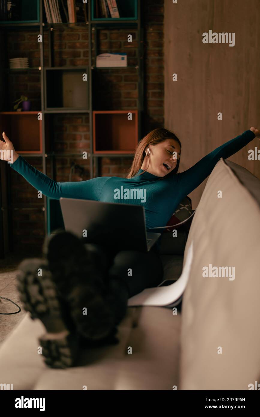 Excited girl waving her hands up and feeling relieved after she ...