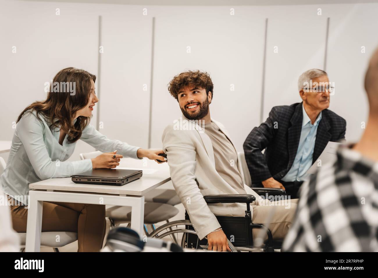 Two happy, smiley, overjoyed colleagues having a conversation at the ...